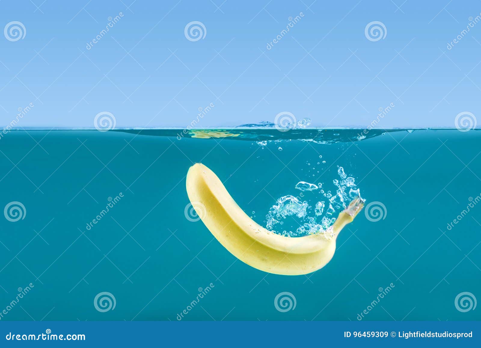 Ripe Yellow Banana Floating in Water with Bubbles Stock Image - Image ...
