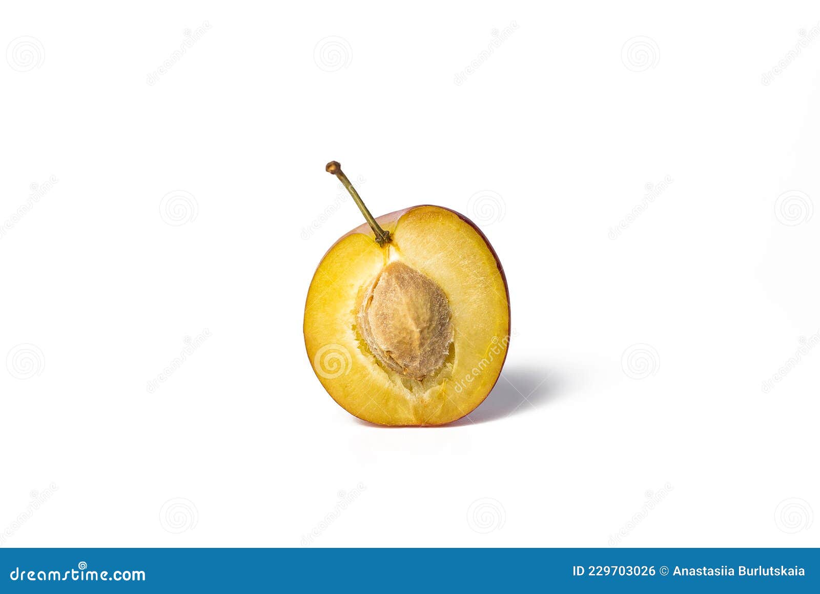 Ripe Yellow Plum. White Background Isolate. Cut in Half with a Bone ...
