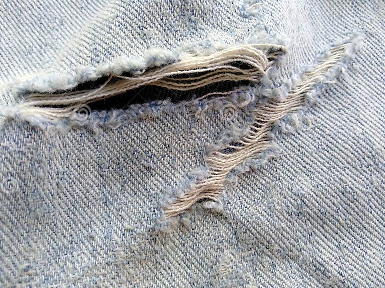 Ripped Destroyed Jeans Background. Jeans Torn Denim Texture Stock Photo ...