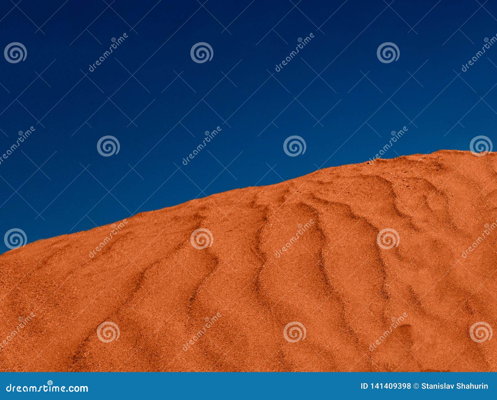The Ripples of Red Sand in the Desert and Blue Sky Stock Photo - Image ...