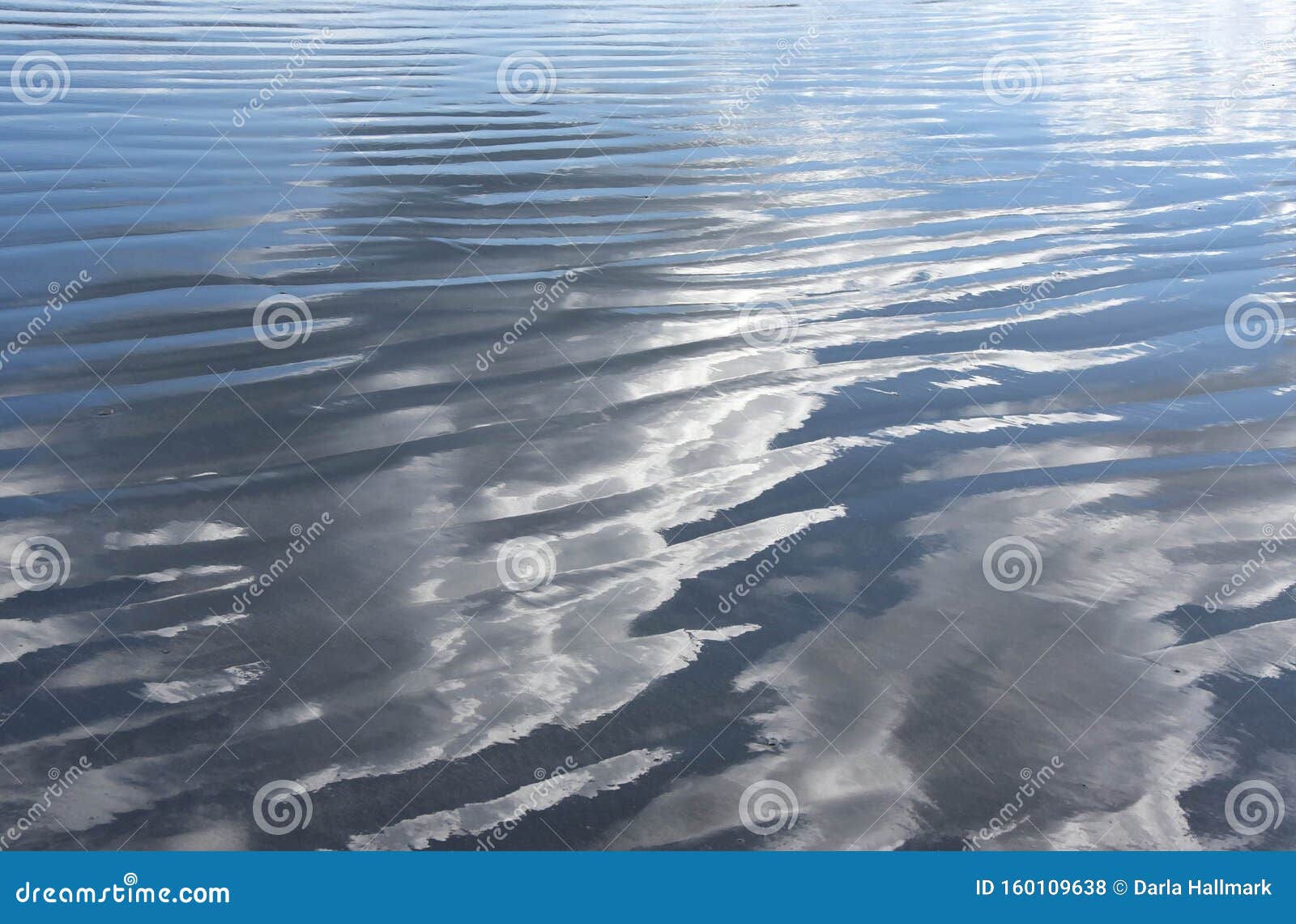 Rippling Waves of Incoming Tide Stock Photo - Image of blue, maine ...