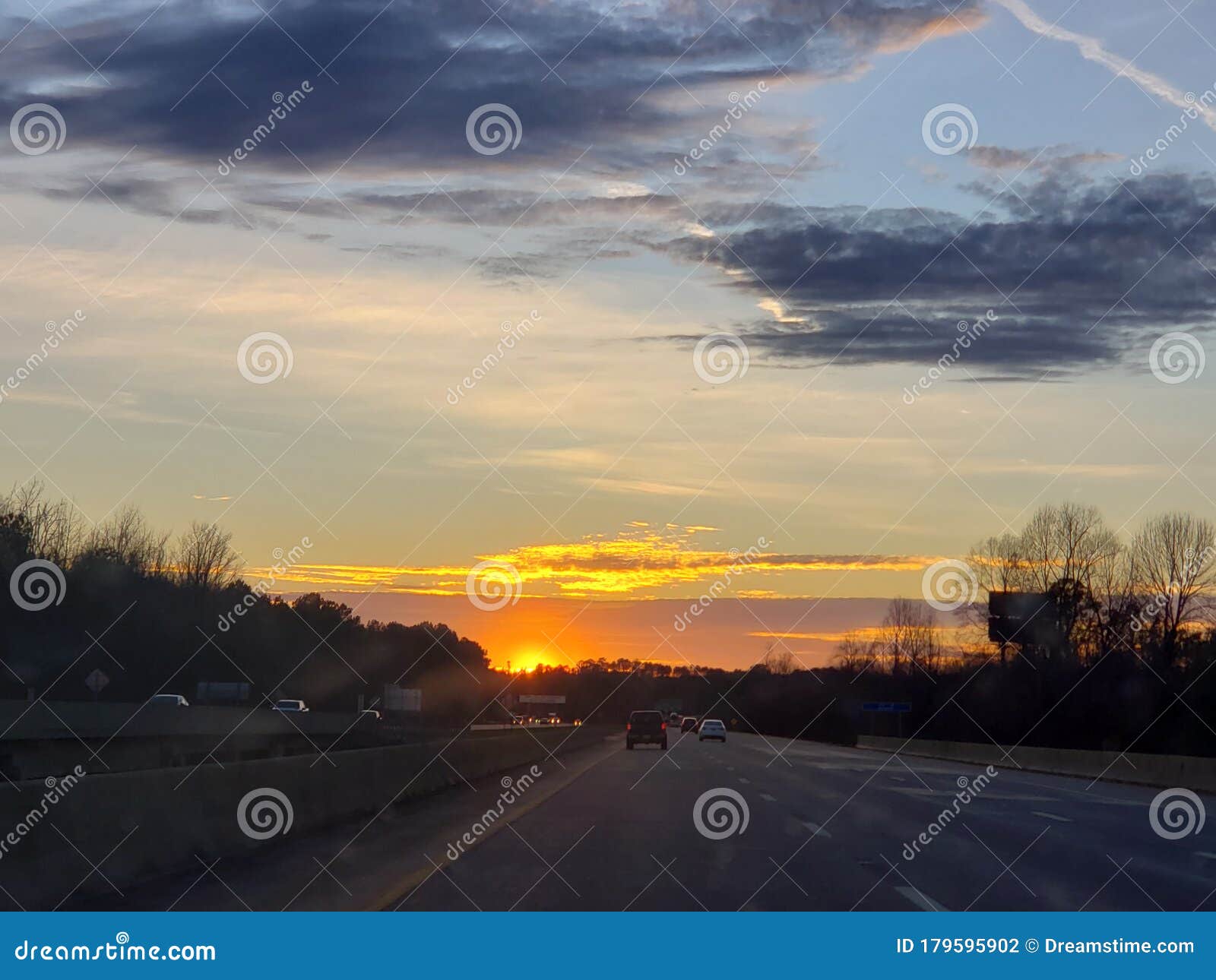 Chasing the sun stock photo. Image of horizon, road - 179595902