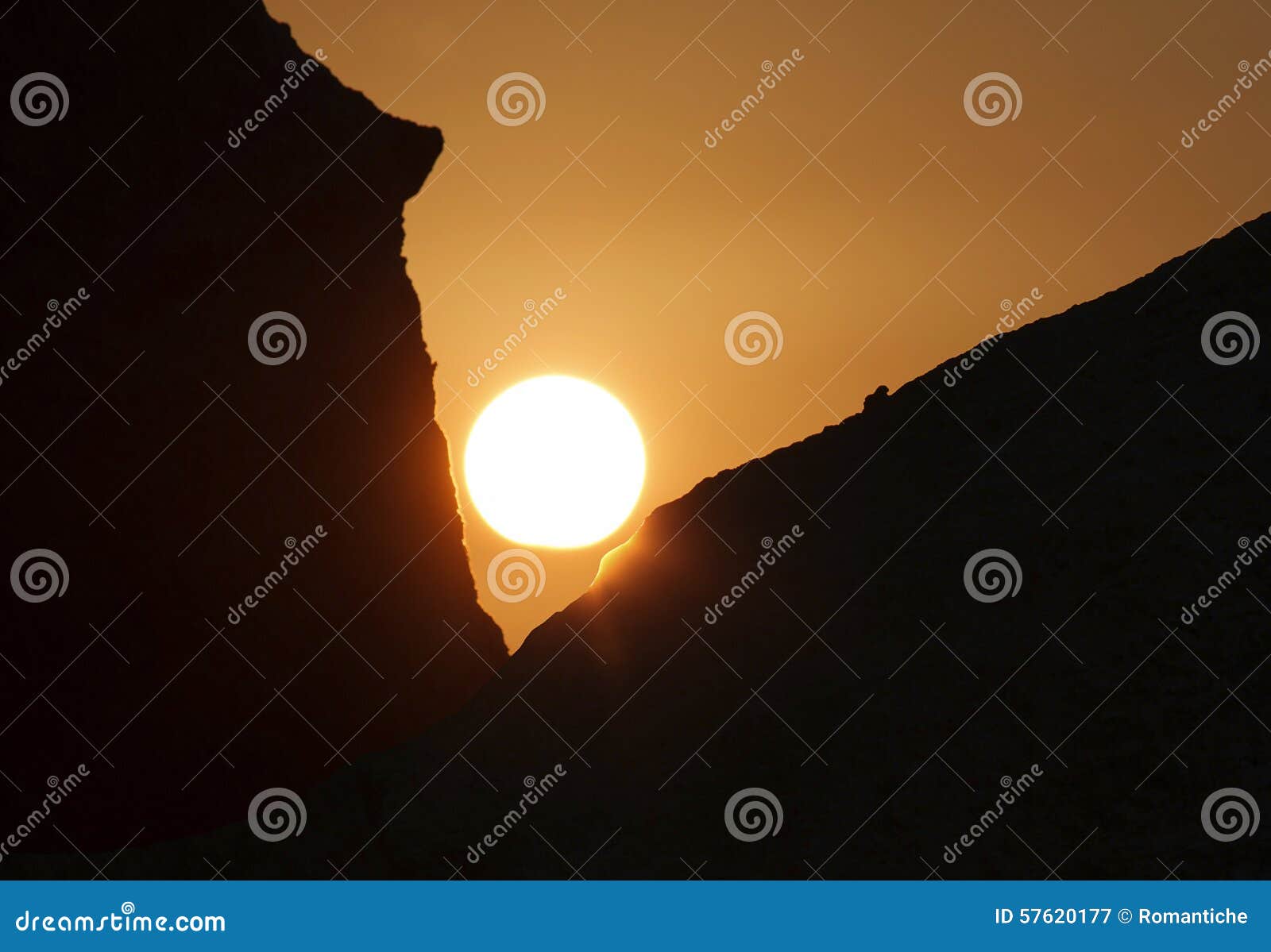 Rising sun among two rocks stock image. Image of rising - 57620177