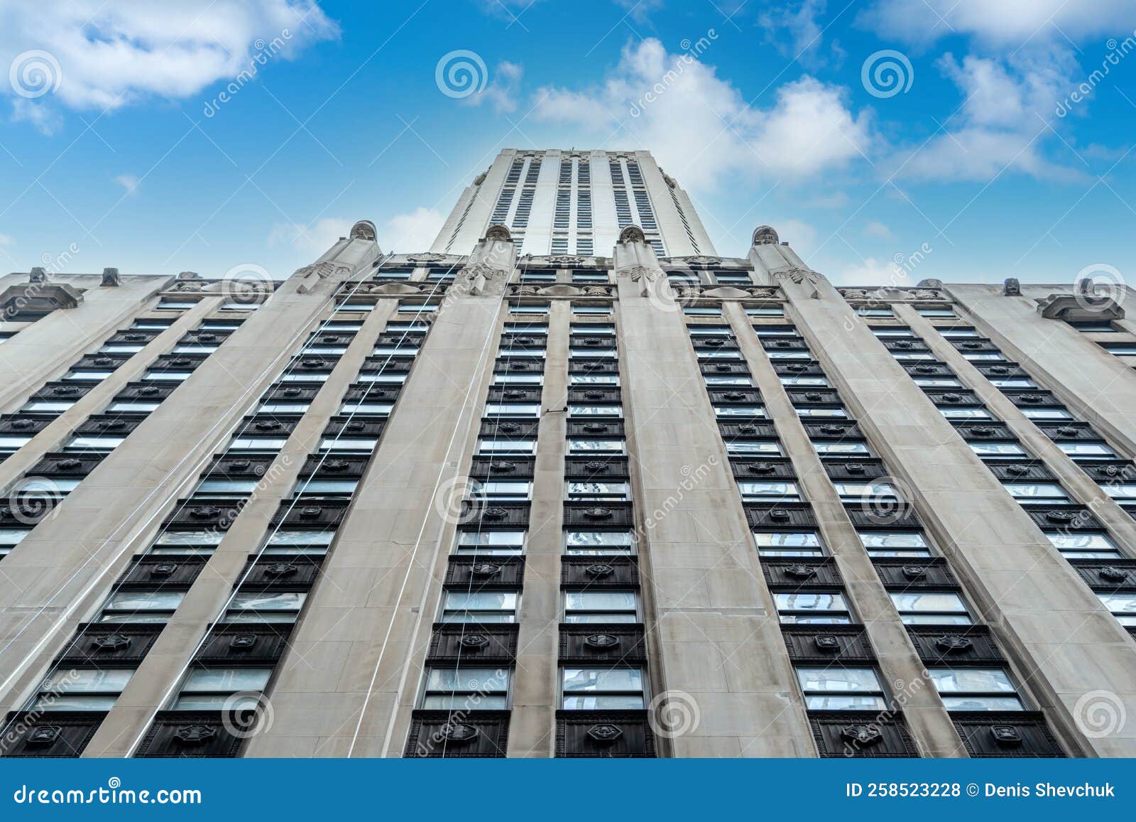 Rising Up Facade of a Skyscraper in a Classical Style with Bas-reliefs ...