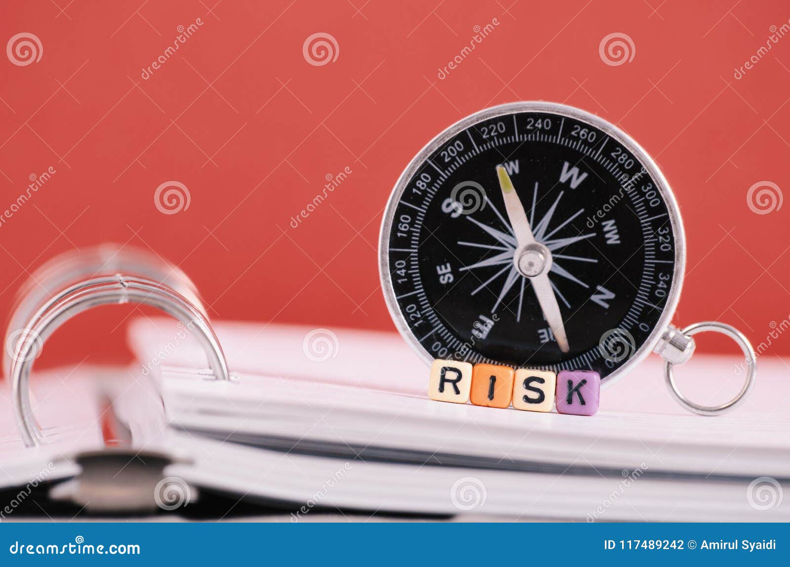 Risk Management Concept.Risk Word Cube on Book Over Compass and Stock ...