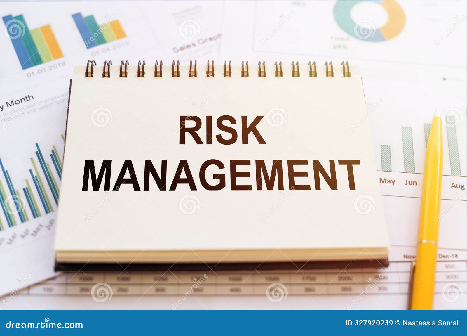 Risk Management Strategies Highlighted in Office Setup with Graphs and ...