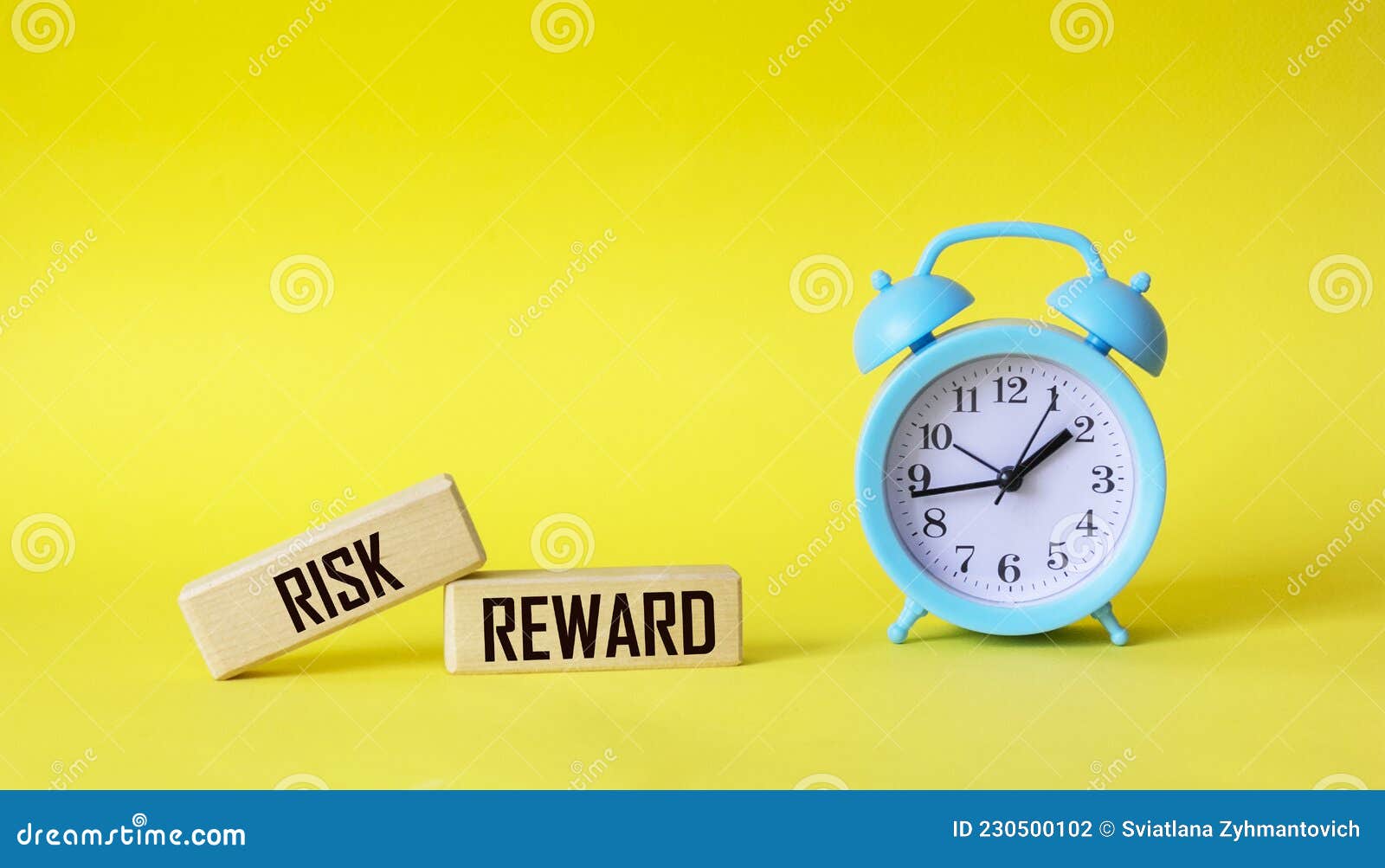 Risk, Reward - Phrase on Wooden Blocks and Yellow Background with Clock ...