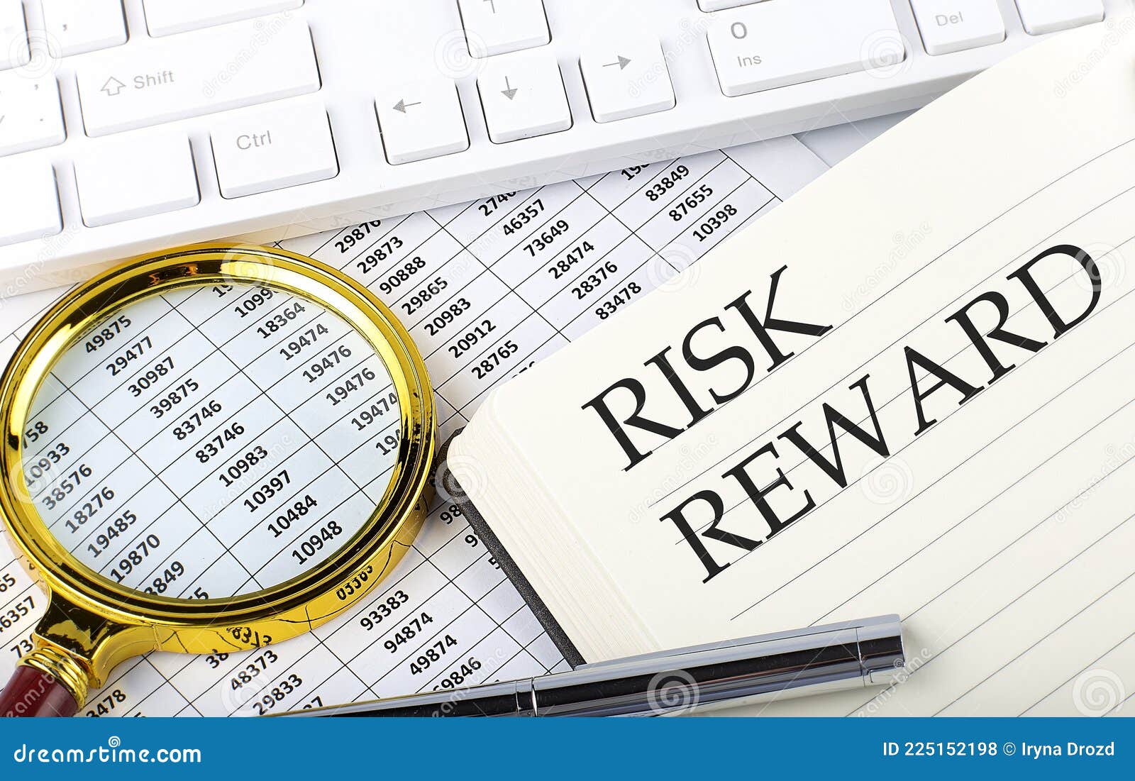 RISK REWARD Text on Notebook with Chart, Magnifier,keyboard and Pen ...