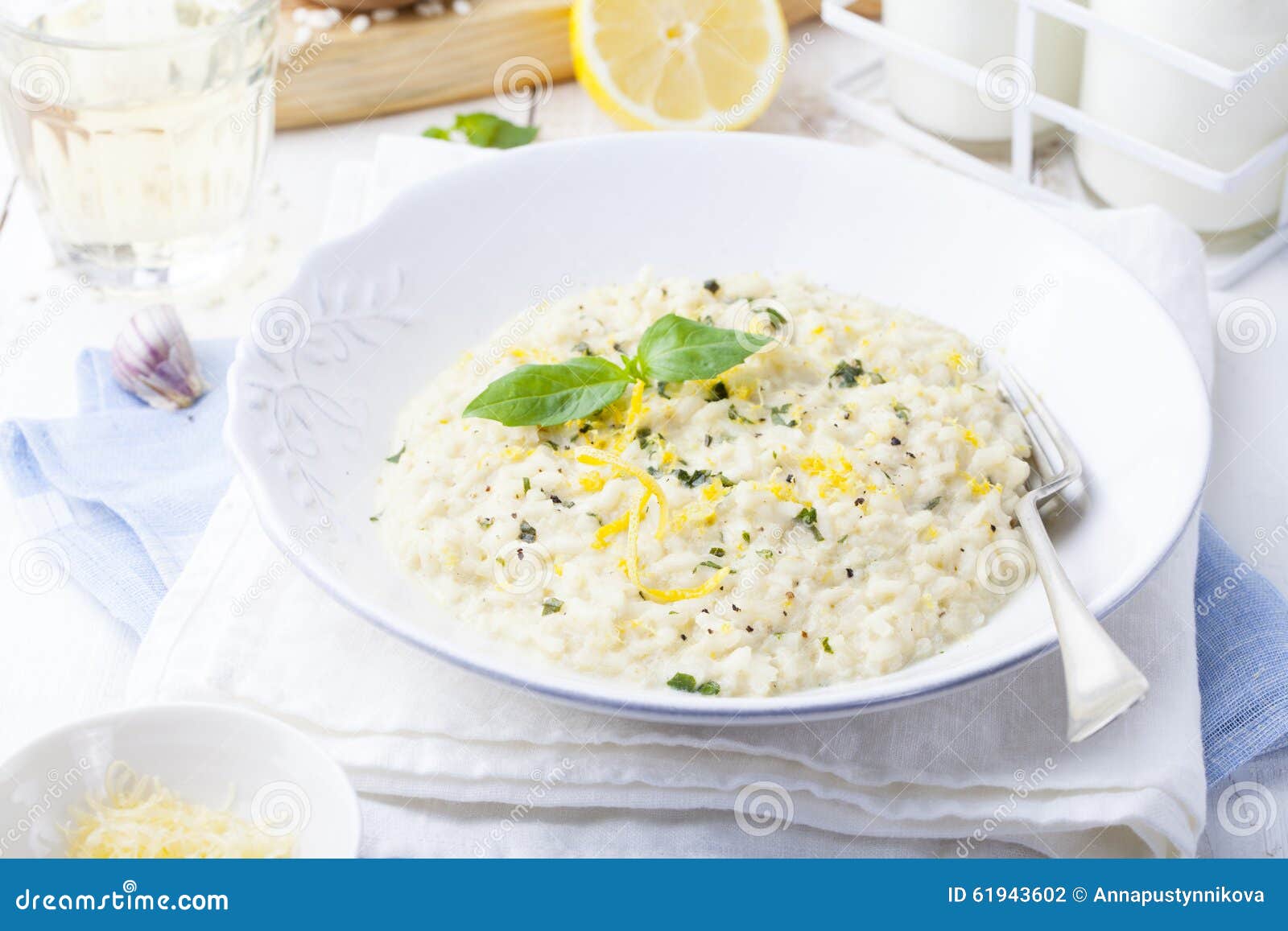 Risotto With Lemon And Fresh Basil. White Wooden Background Stock Photo ...