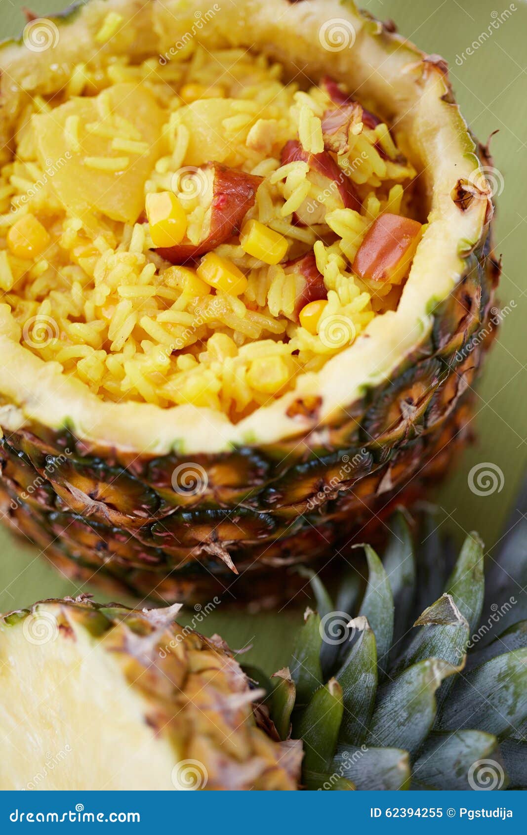 Risotto with Pineapple Pieces and Ham Inside Pineapple Fruit Stock ...