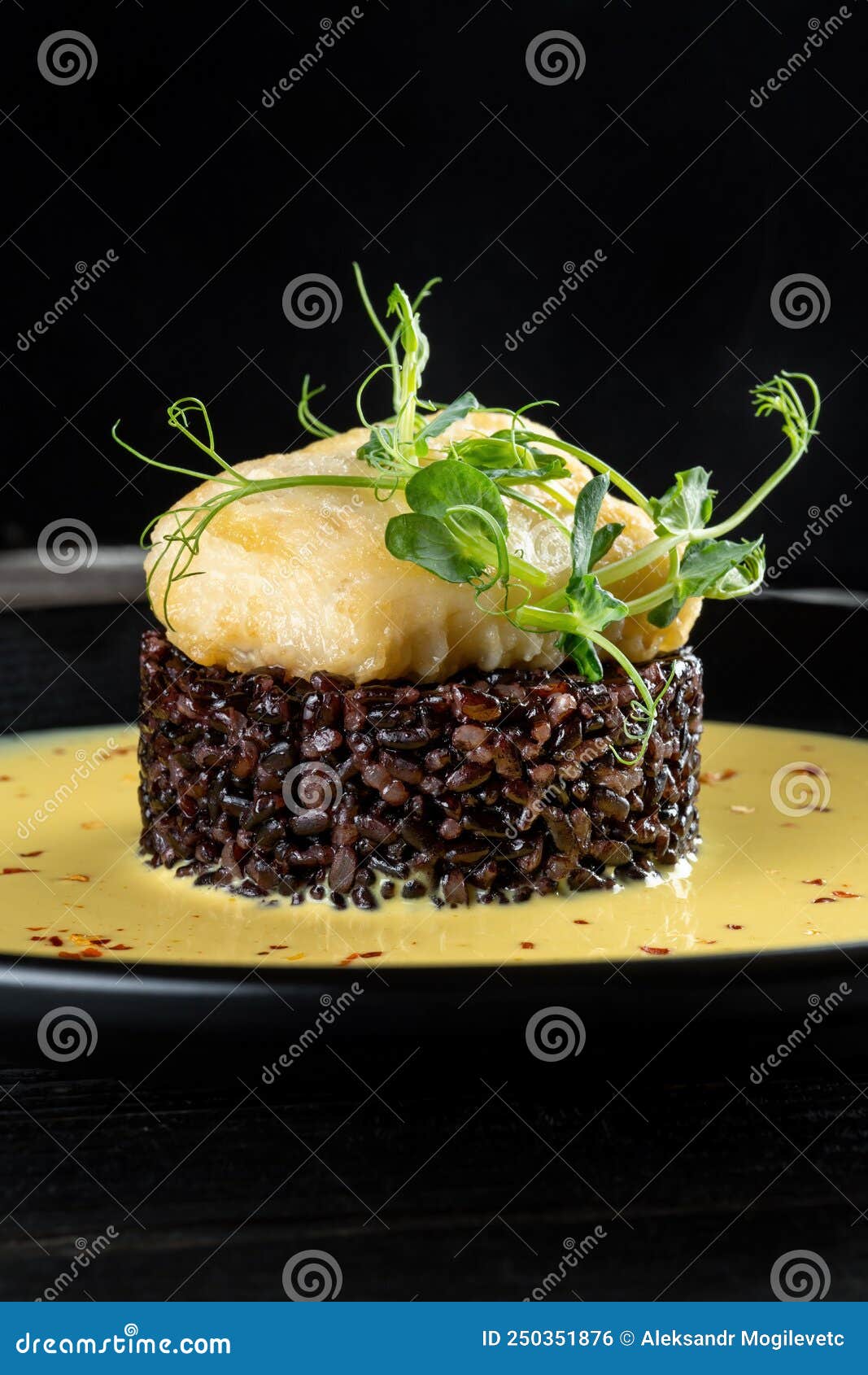 Risotto with Slice Roasted White Fish, Cod on Black Background. Grilled ...