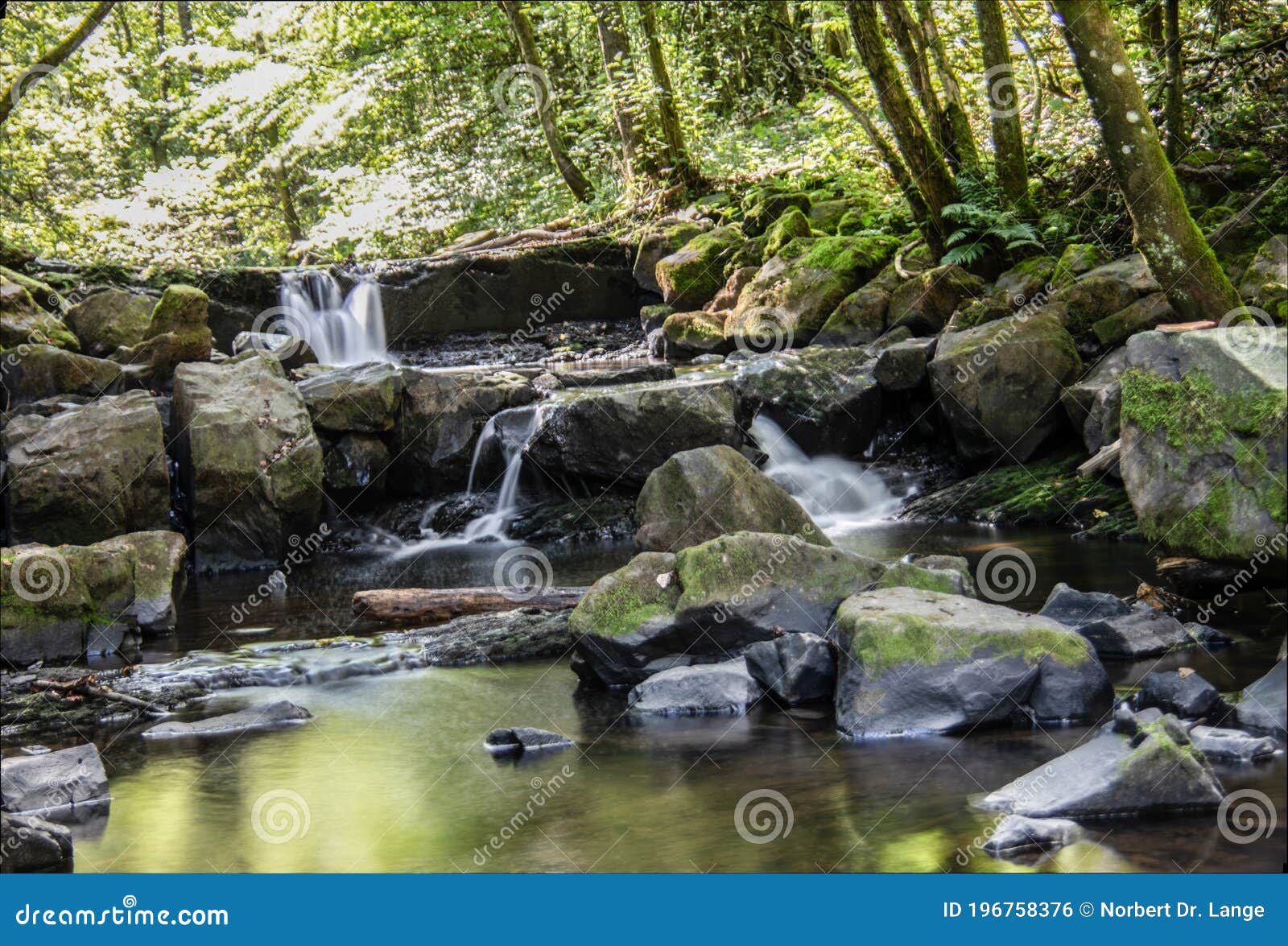 River Course Littered with Rocks with Waterfall Stock Photo - Image of ...