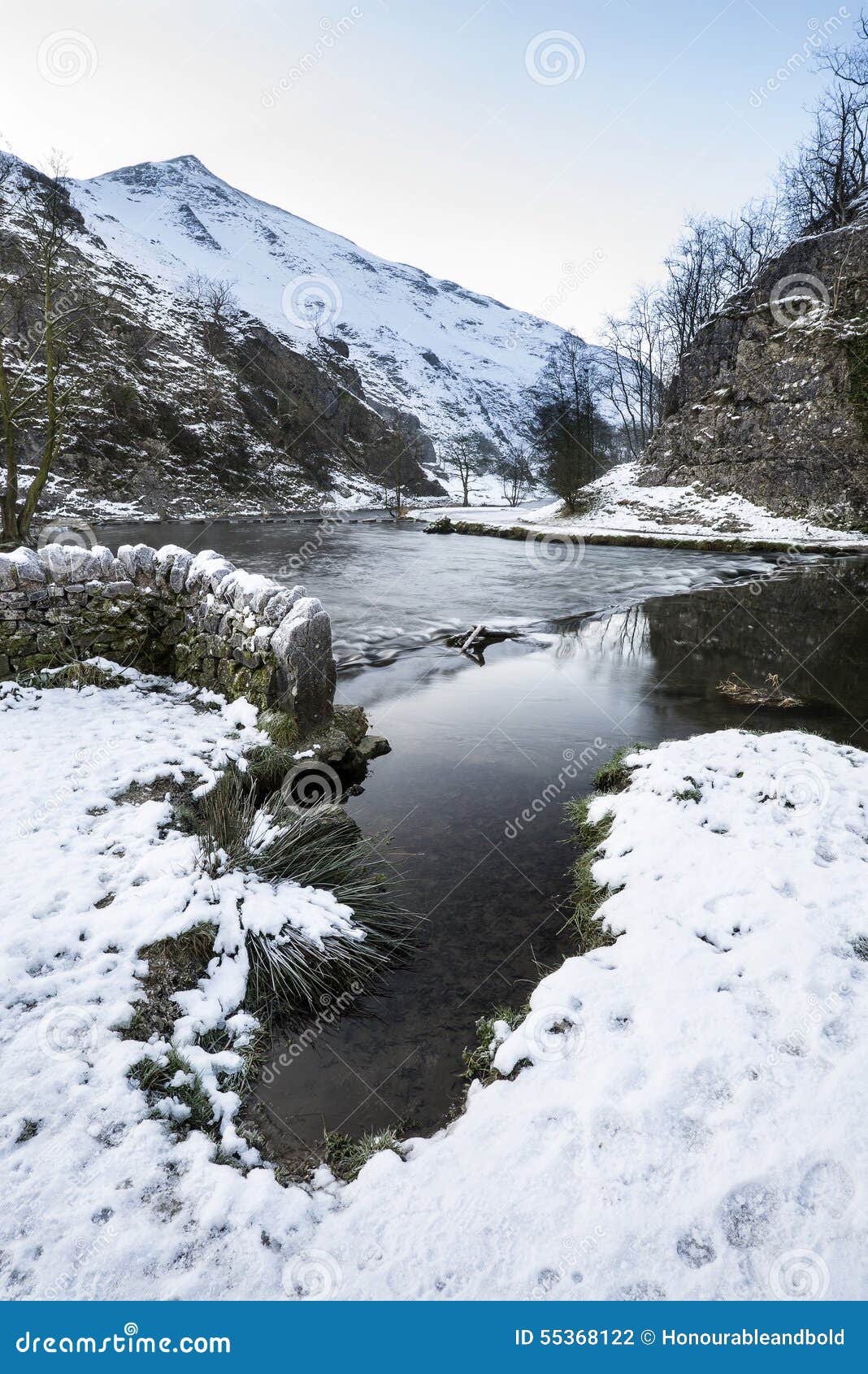 River Flowing through Snow Covered Winter Landscape in Forest Va Stock ...