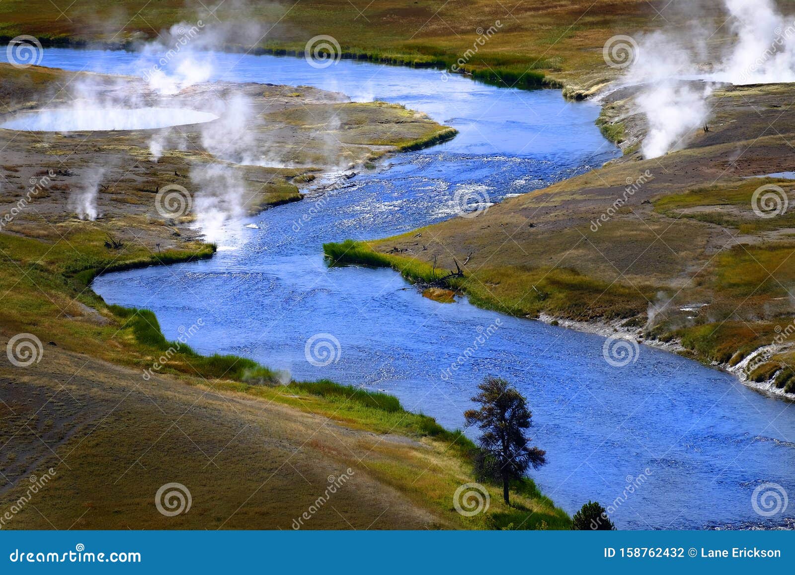 River Flowing with Steam Rising in Yellowstone Stock Photo - Image of ...