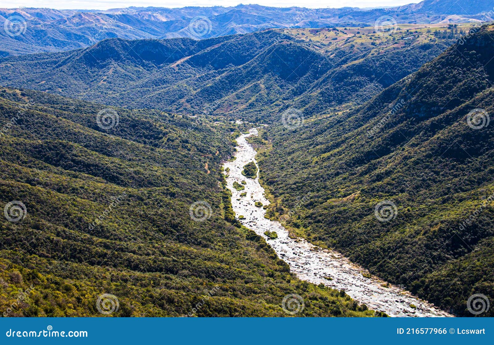 River Flowing through Steep Tree-Lined Valley Stock Photo - Image of ...