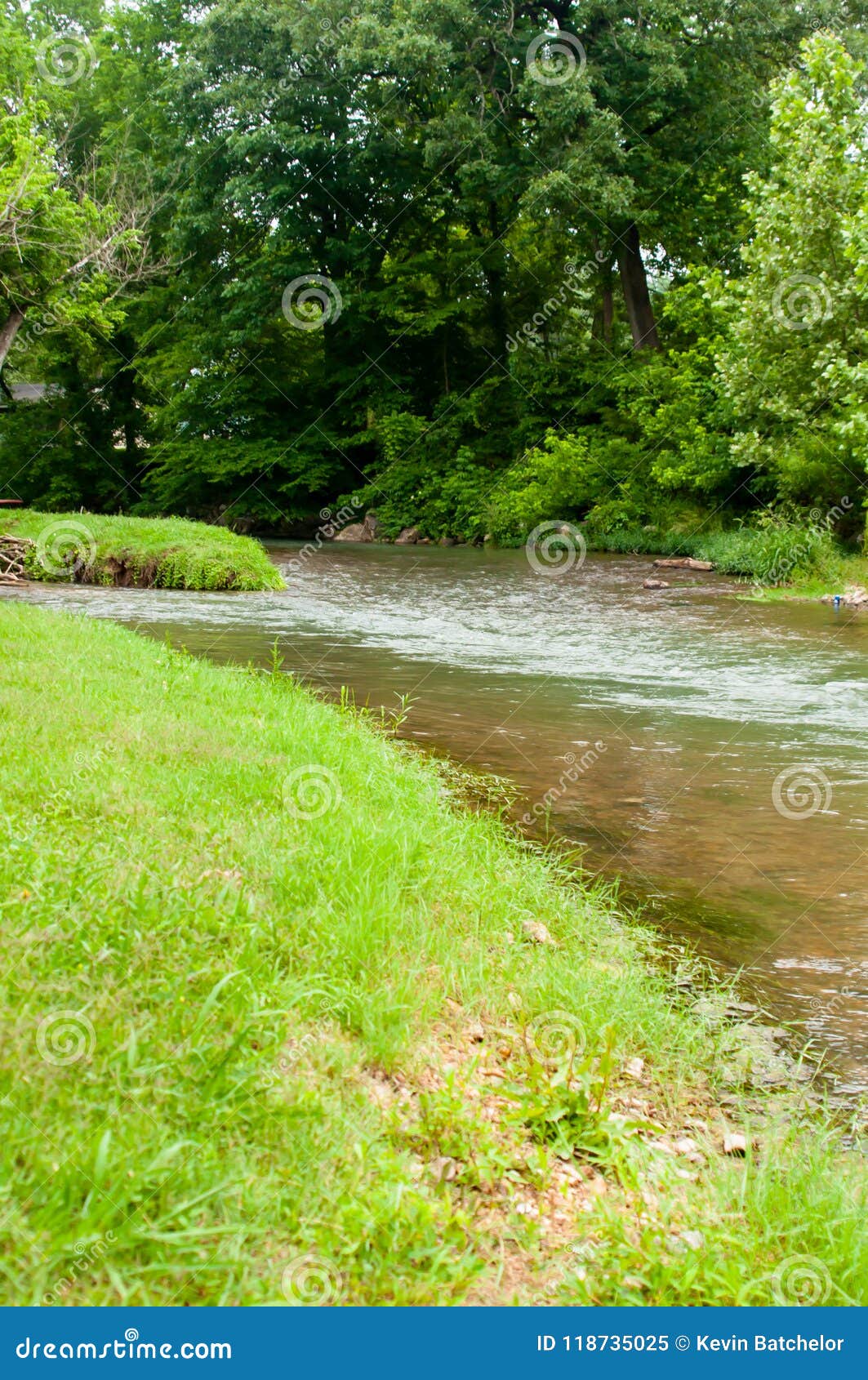 River Flows Past a Grassy Bank Stock Image - Image of grass, flow ...