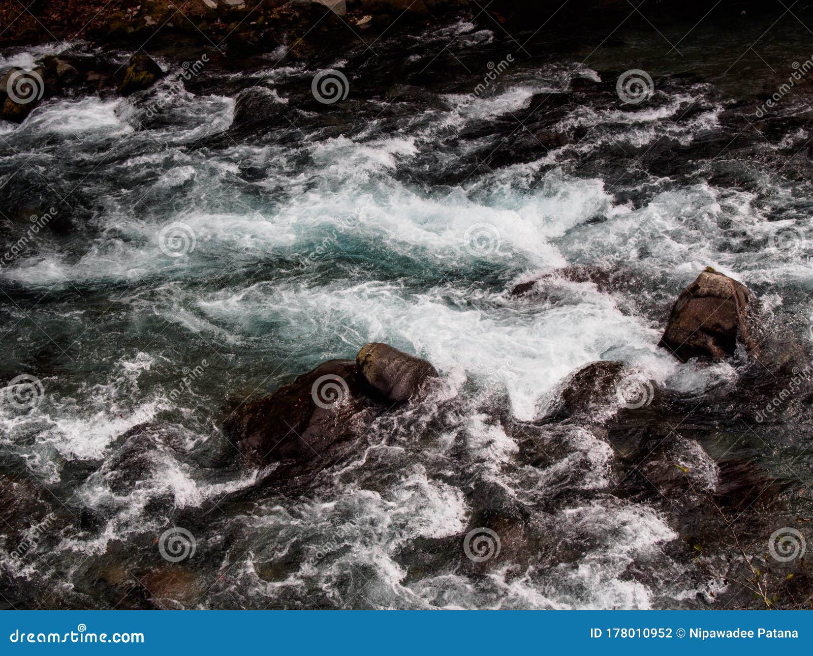 The River Flows through the Rocks Stock Photo - Image of color, flowing ...