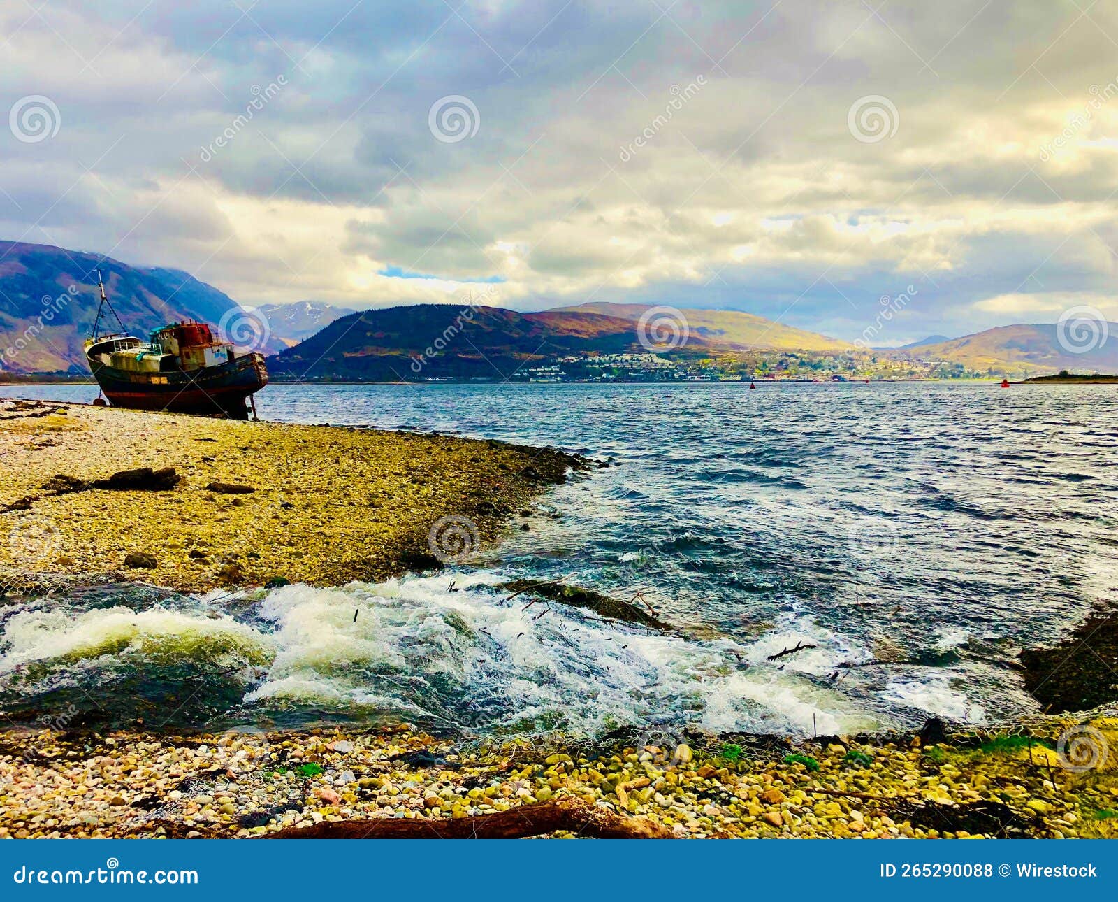 River Going into a Body of Water with a Washed Up Ship in the ...