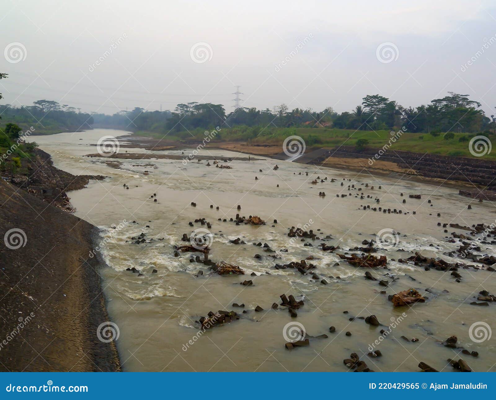 A River with Murky Water and Lots of Rocks. Stock Image - Image of ...