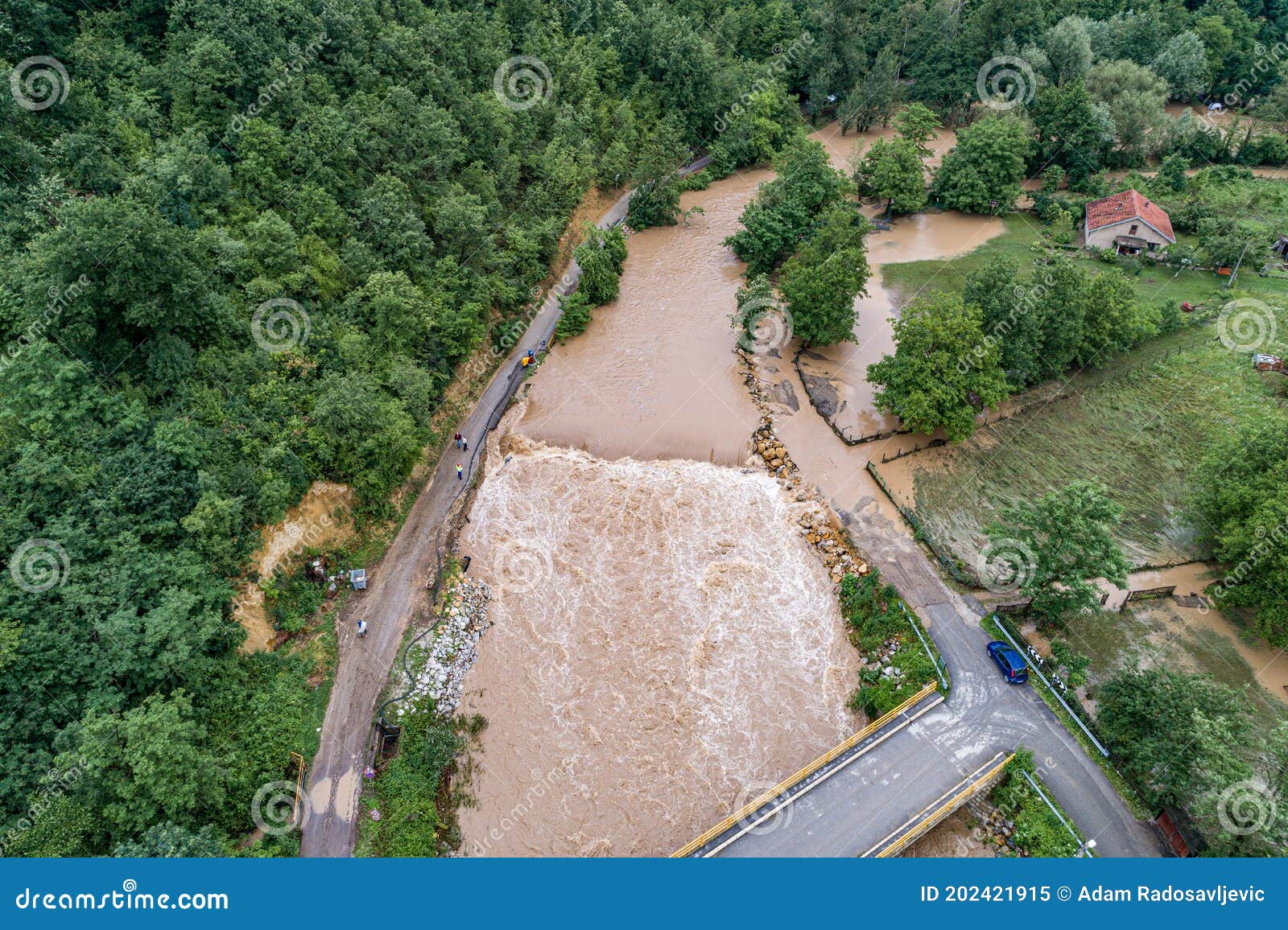 A River that Overflows Threatens the Road Bridge and Property Stock ...
