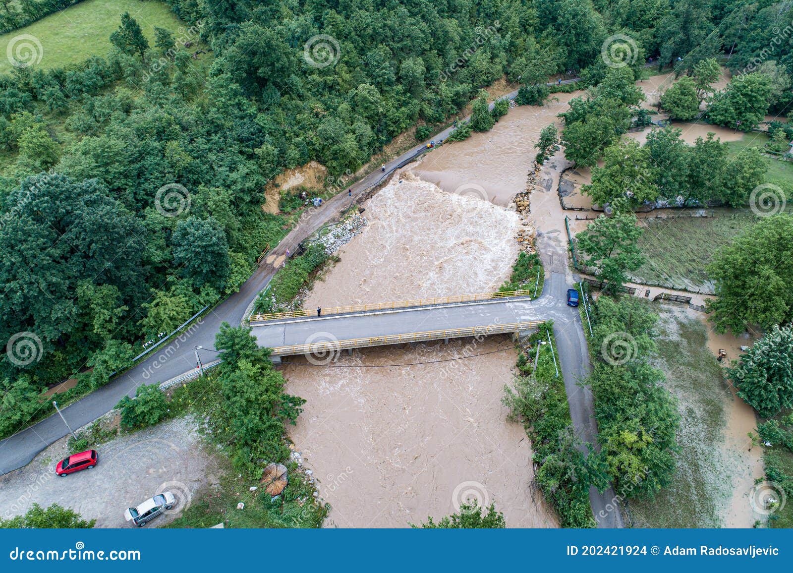A River that Overflows Threatens the Road Bridge and Property Stock ...