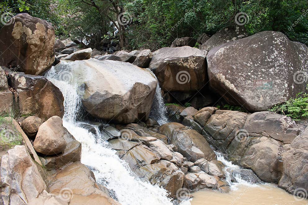 River Rapids through Large Boulders in the Forest Stock Image - Image ...
