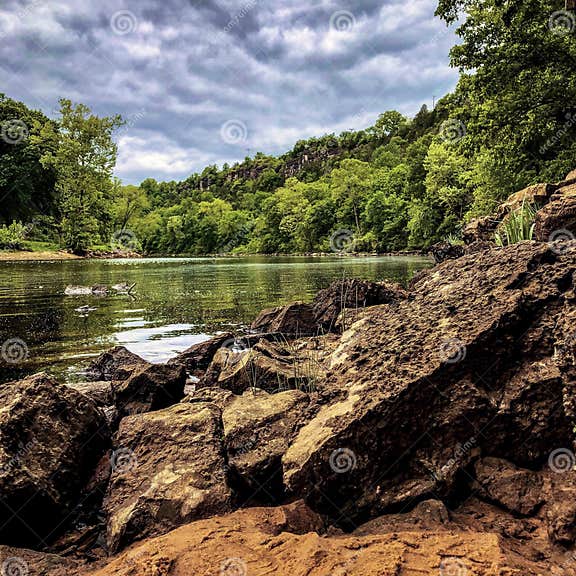 River rock bed stock photo. Image of water, trees, clouds - 159464264
