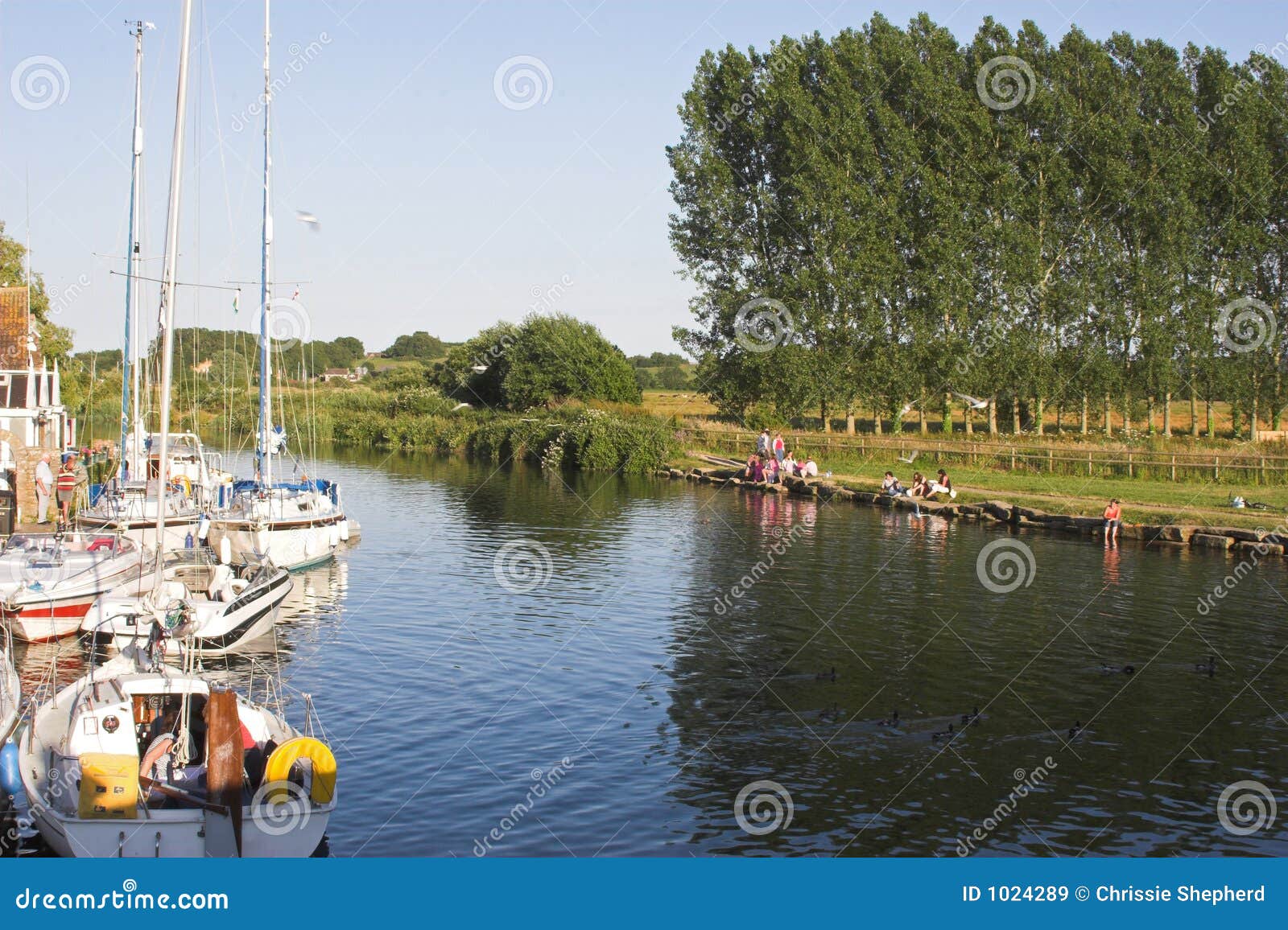 River Scene with Boats & People Stock Image - Image of picnic, river ...