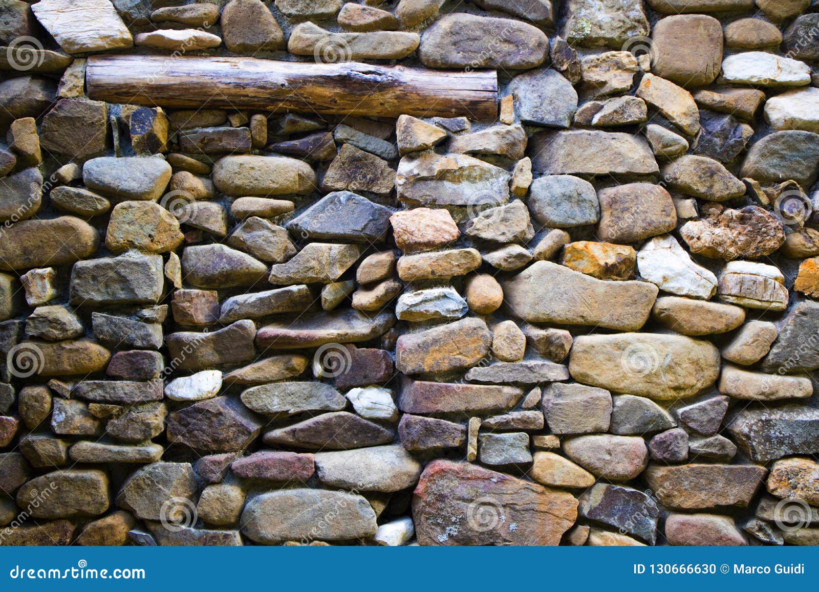 River stone wall stock photo. Image of color, pebble - 130666630
