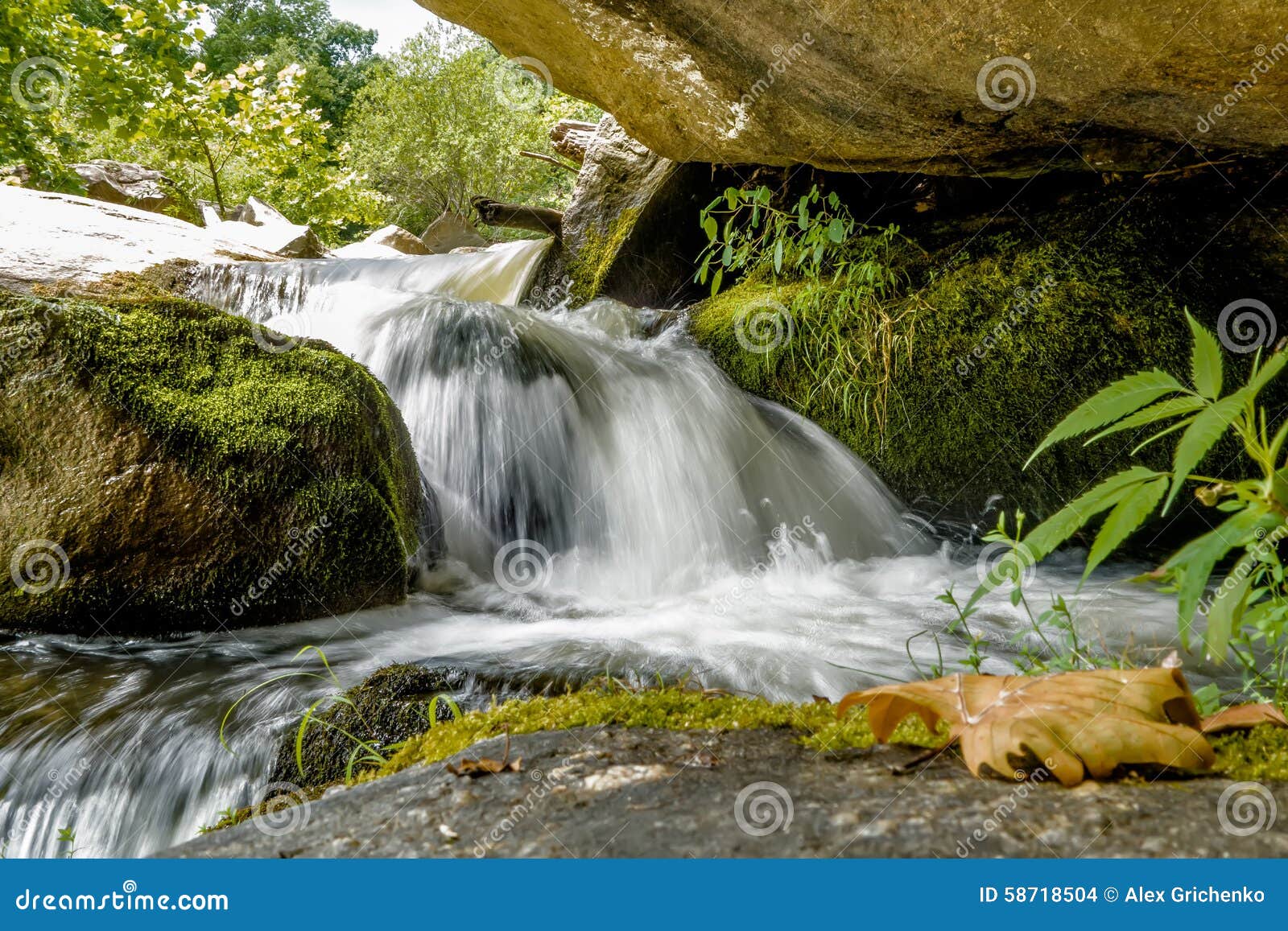 River Stream Flowing Over Rock Formations in the Mountains Stock Photo ...