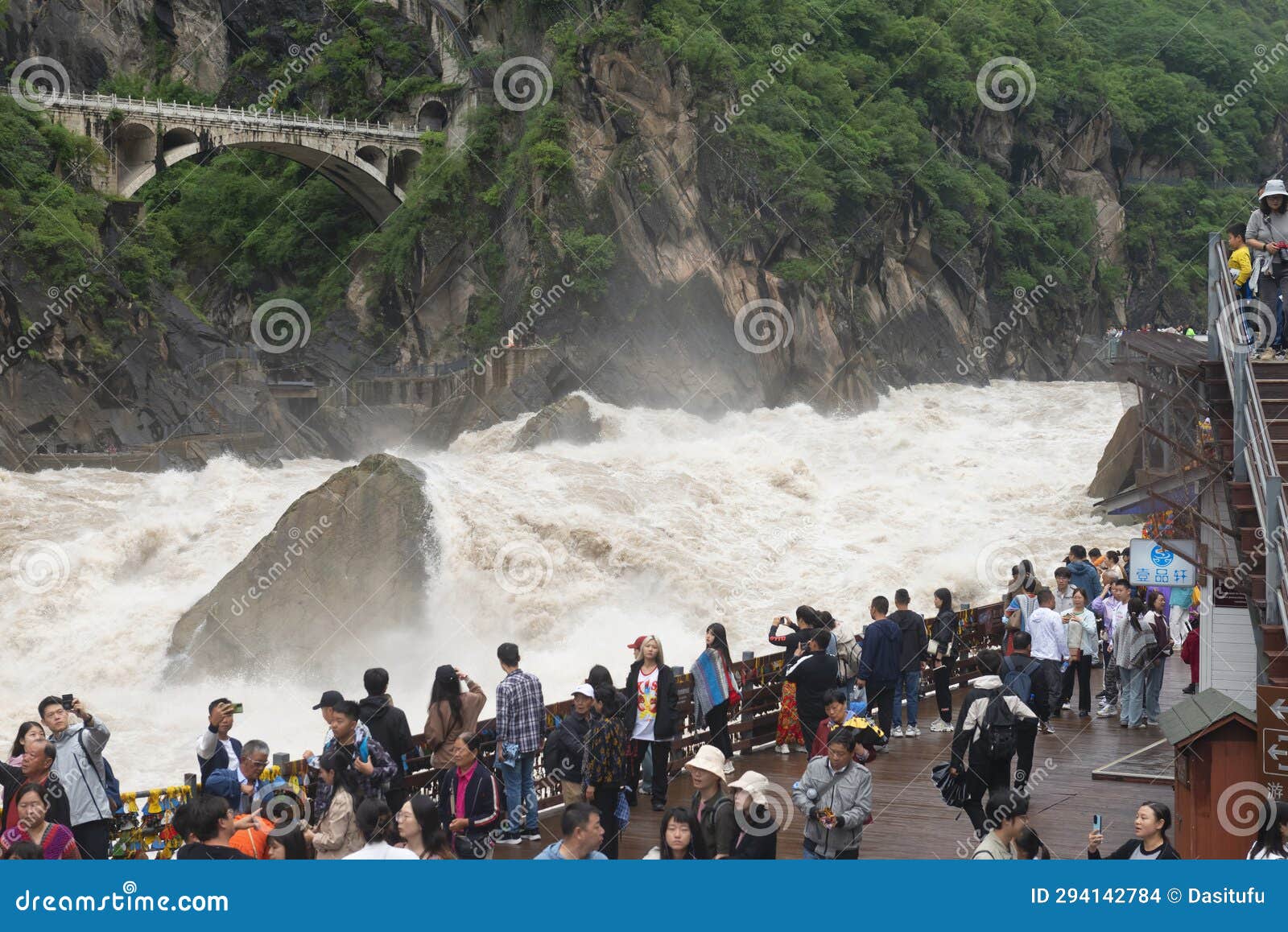 River Surging in Canyon Scenery with Tourist at Tiger Leaping Gorge ...