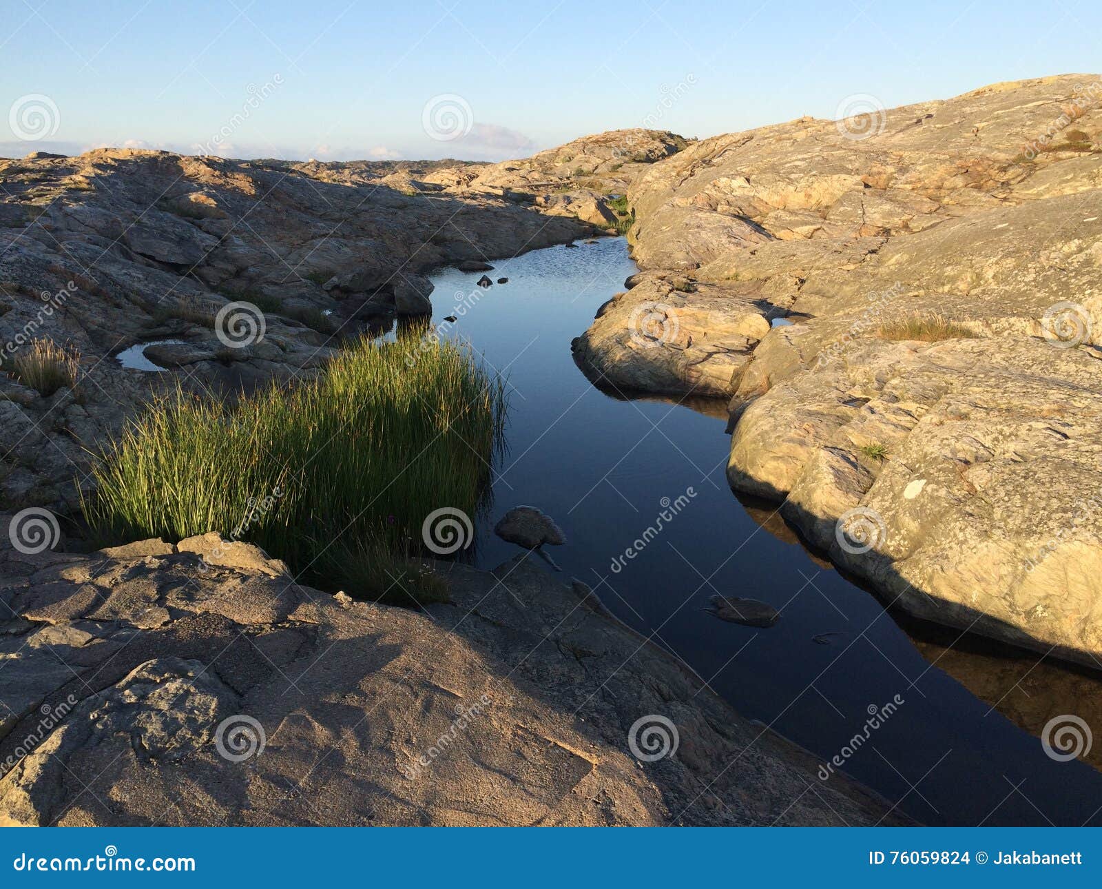 River surrounded by rocks stock photo. Image of reflection - 76059824