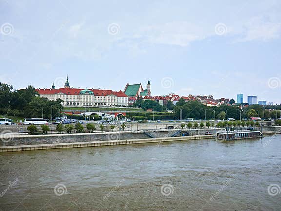 Historic Riverside Complex Blends with Modern Skyline Under Overcast ...