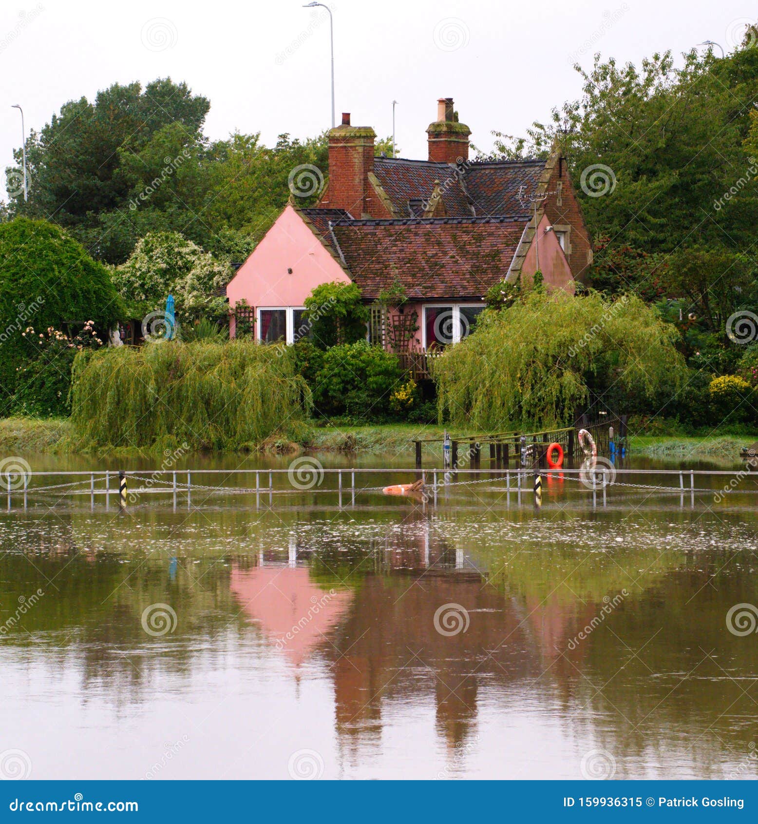 Riverside Cottage at High Tide. Stock Image - Image of cottage, coastal ...