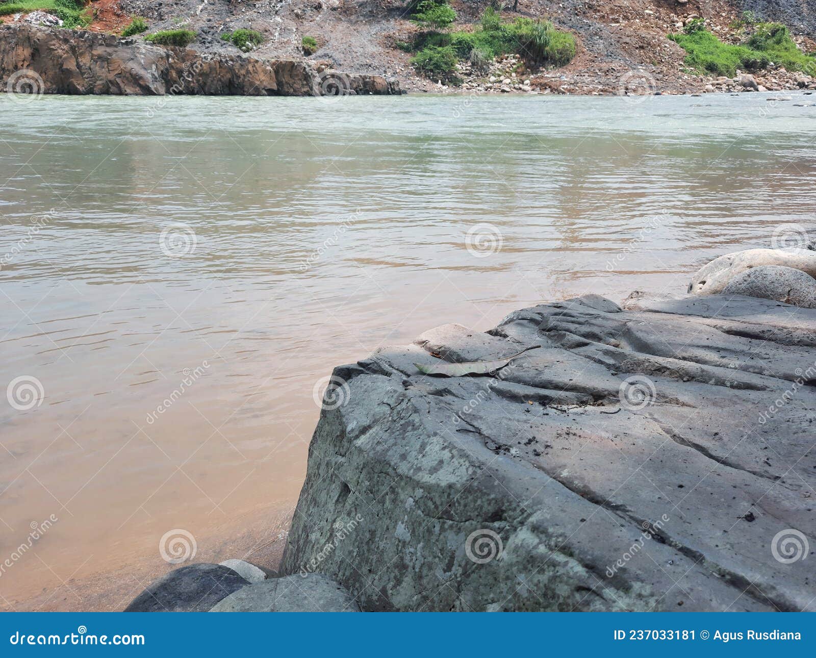 Big rock by the river stock image. Image of shore, riverside - 237033181