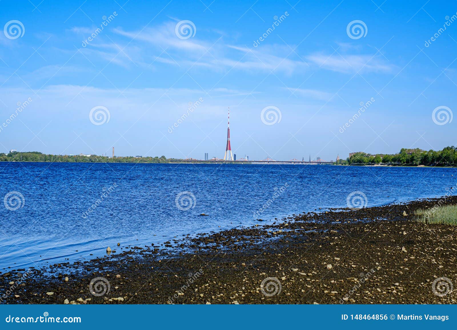 Riverside Shore in Spring with Scenic Trees and Green Pastures Stock ...