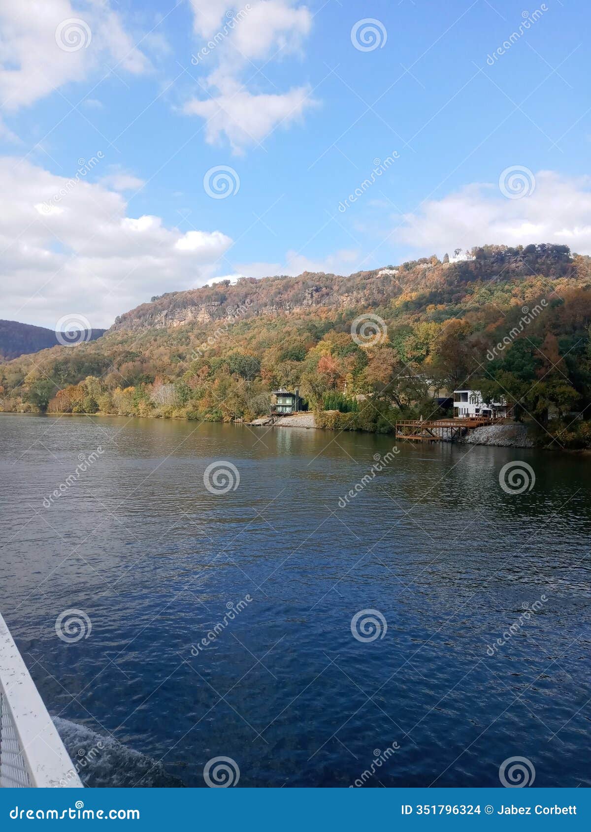 A Riverside View with White Clouds in a Blue Sky. Stock Photo - Image ...