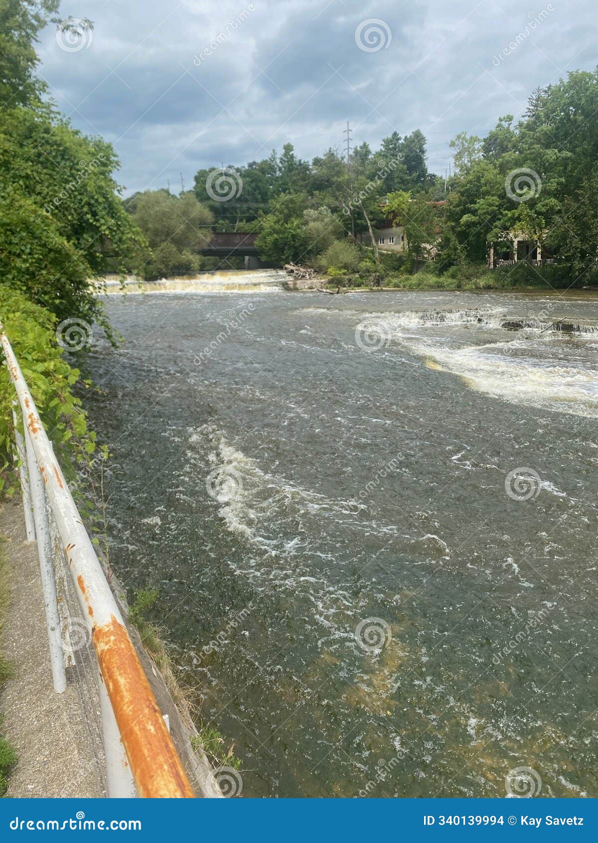 Riverside, Waterfall with Rusted Railing Stock Photo - Image of falls ...