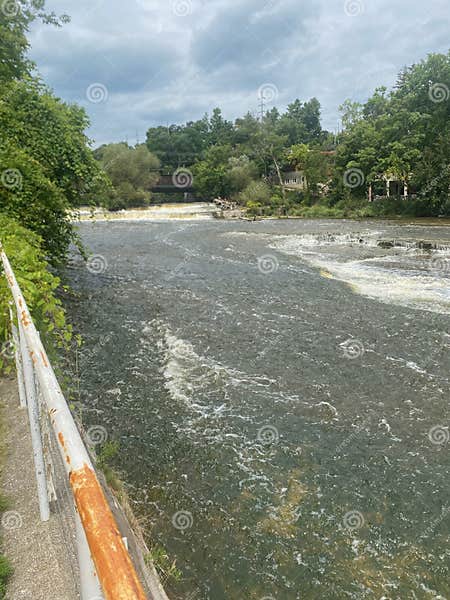 Riverside, Waterfall with Rusted Railing Stock Photo - Image of falls ...