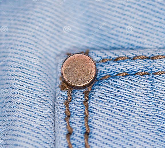 Rivet on denim close-up stock photo. Image of fabric - 196973866