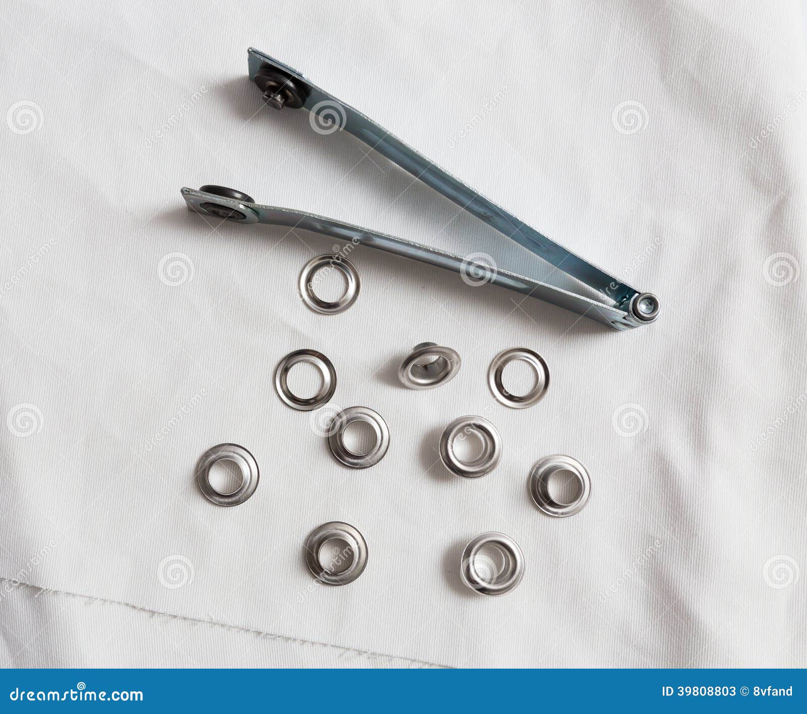 Rivets on Light White Cloth Stock Image - Image of silver, hole: 39808803
