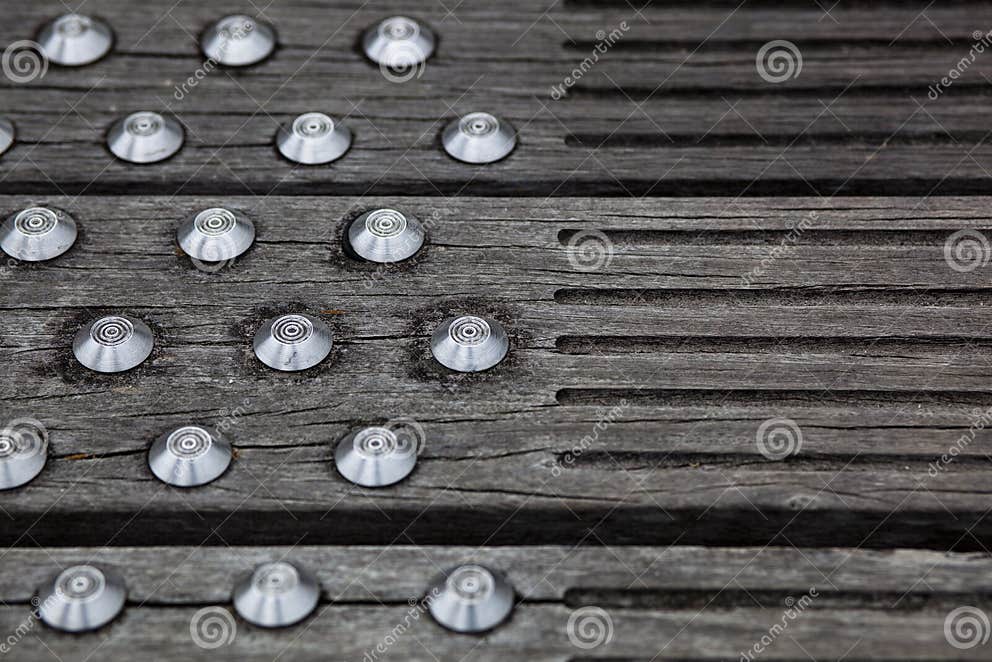 Rivets in wood deck stock photo. Image of circular, grain - 256022608