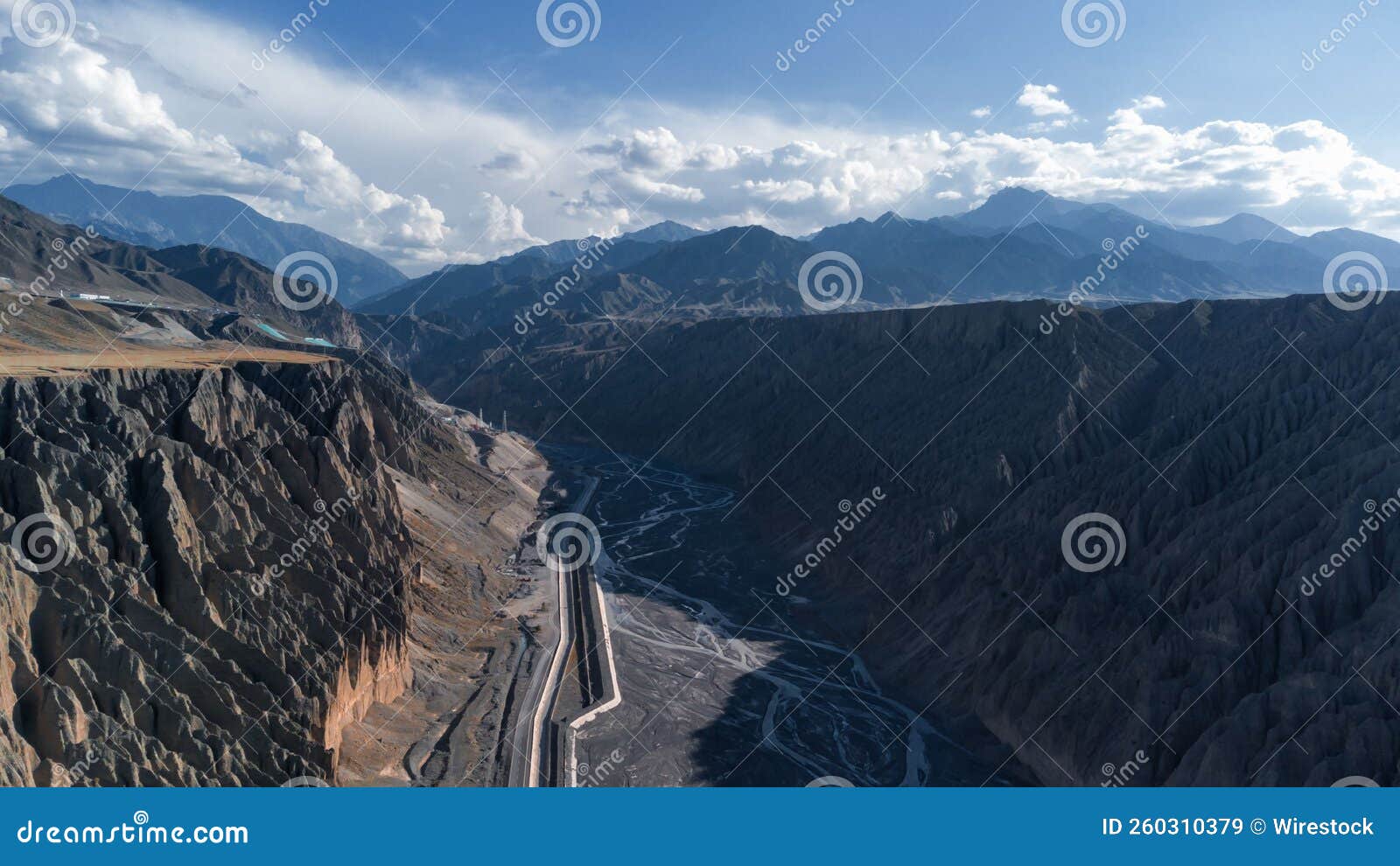 Road Along the River Going through Mountains and Cliffs, Aerial Stock ...