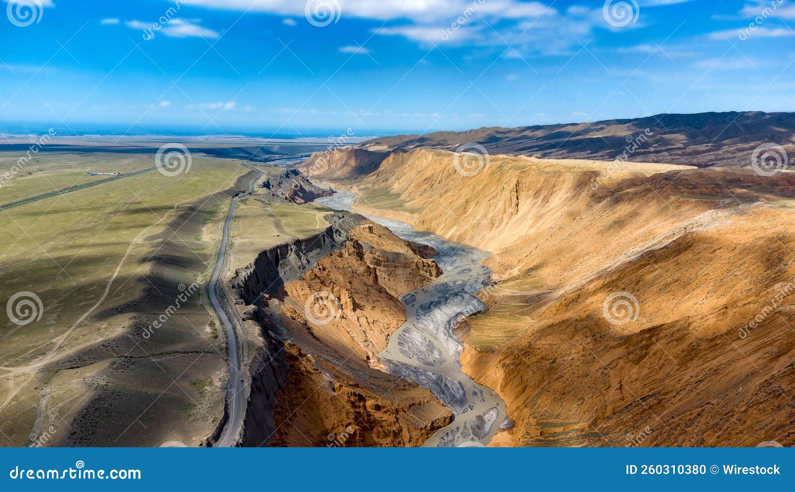 Road Along the River Going through Mountains and Cliffs, Aerial Stock ...