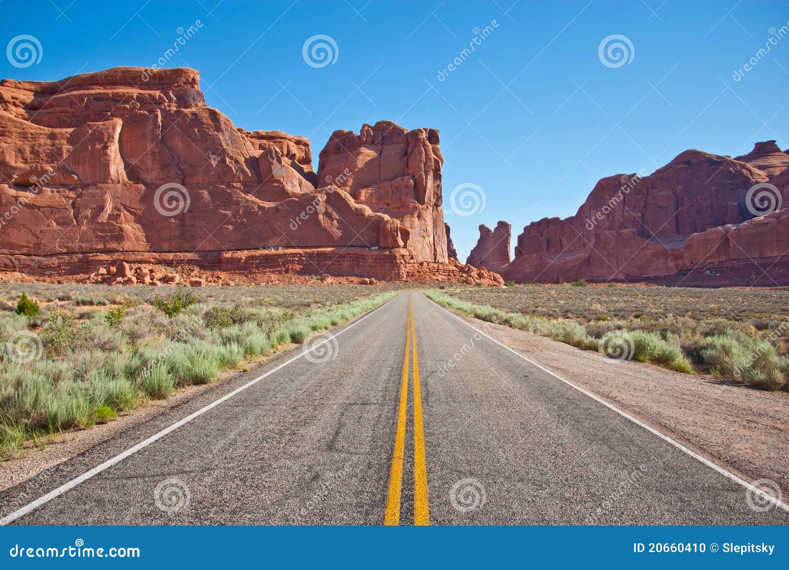 Road through Arch National Park Stock Photo - Image of yellow, white ...