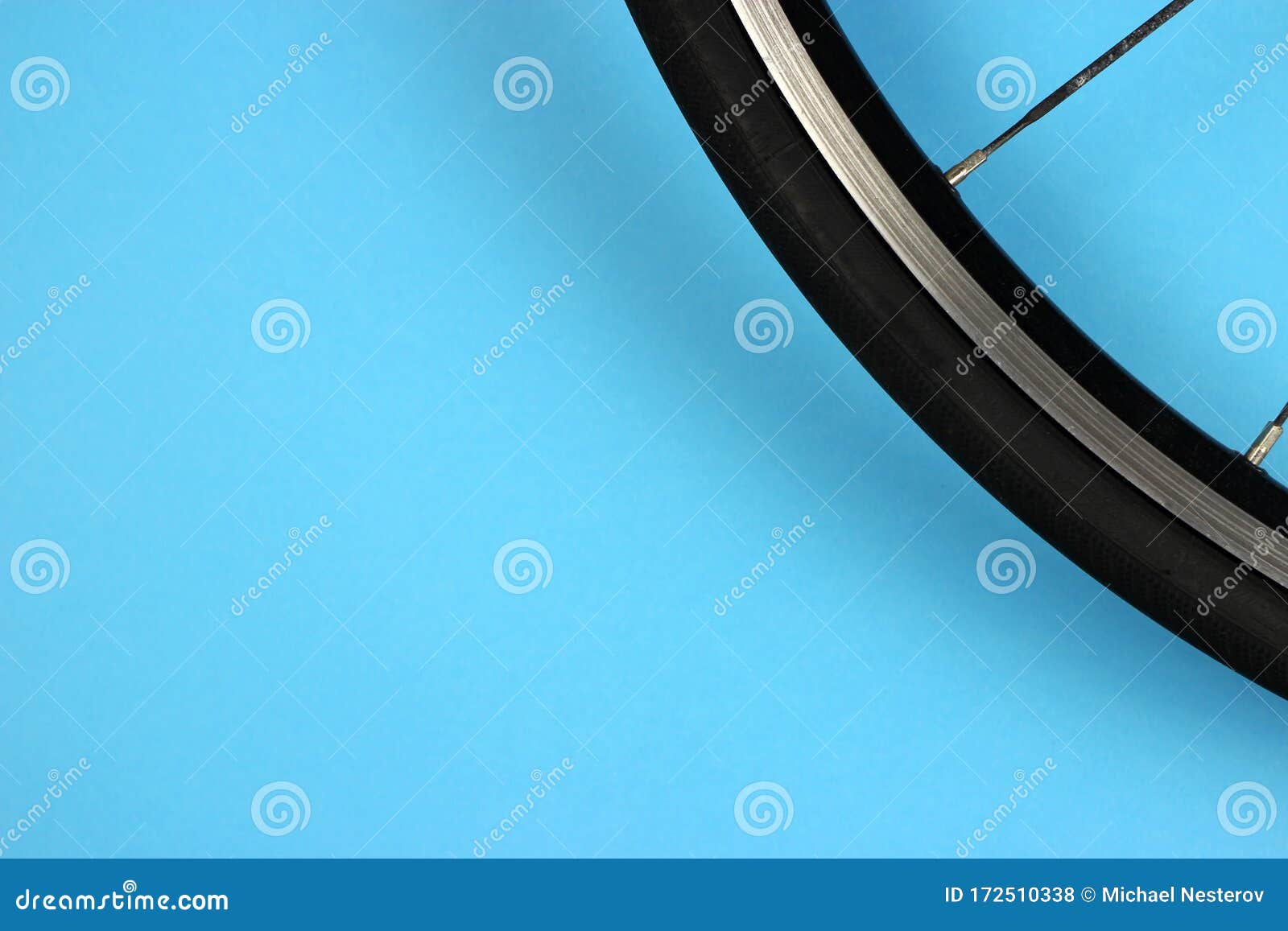 Road Bike Wheel on a Blue Background. Copyspace for Your Text Stock ...