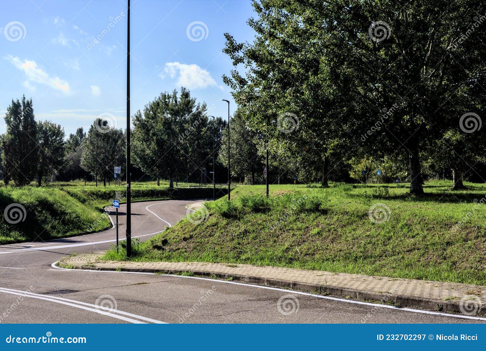 Road Bordered by Enbankment with Trees in the Countryside Stock Image ...