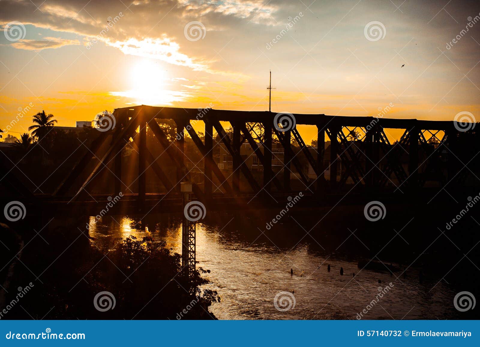 Road Bridge on River during a Golden Sunset in Stock Photo - Image of ...