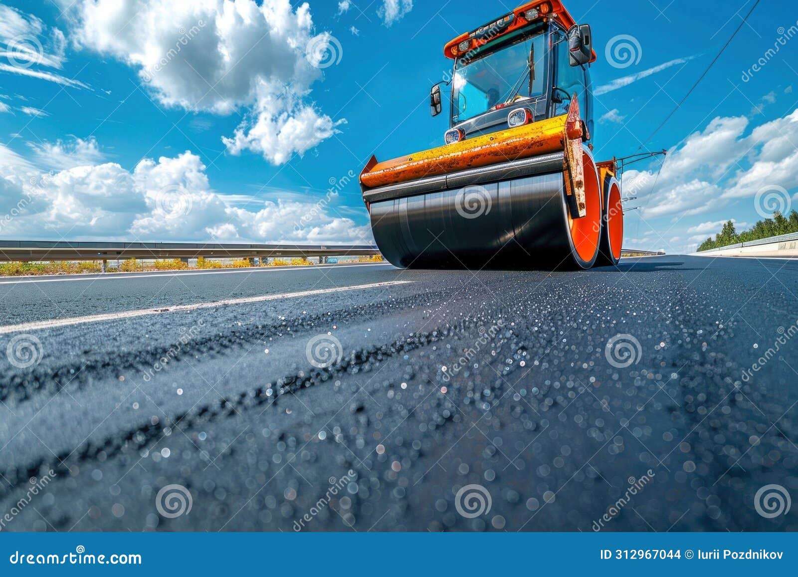 Road Construction Asphalt Paving with a Steamroller Machine on the New ...