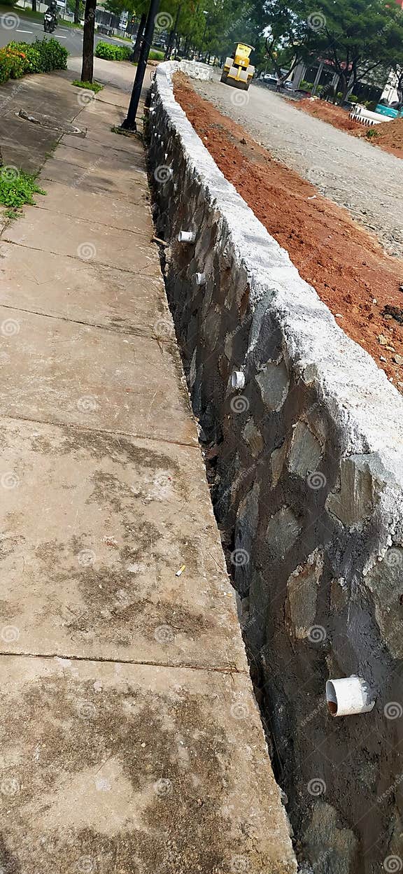 Road Construction and Drainage System Installation in Progress ...